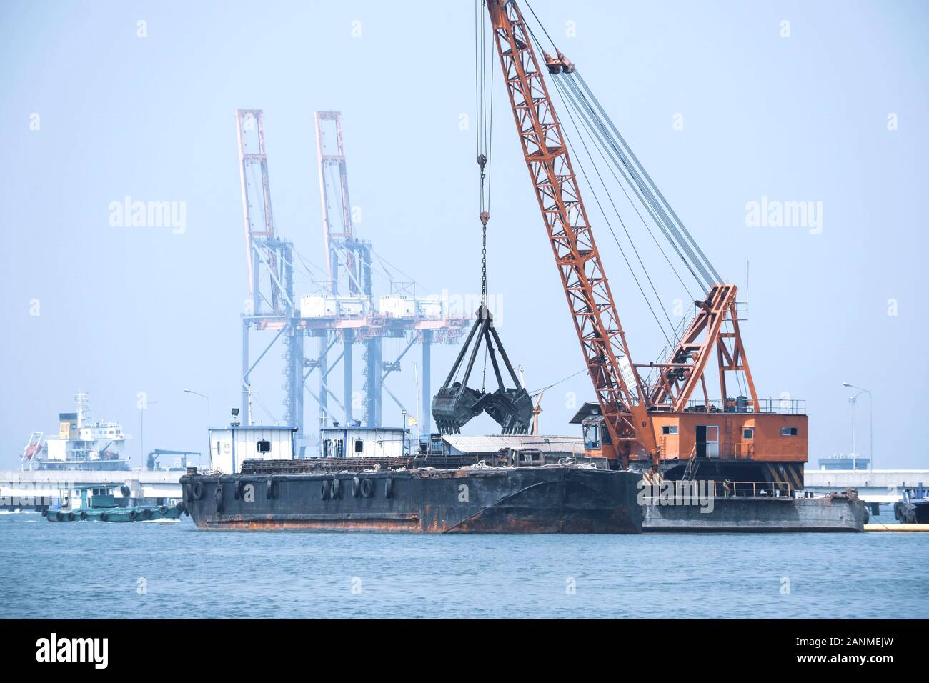 Sand tanker at the sand loading station with loader Stock Photo - Alamy