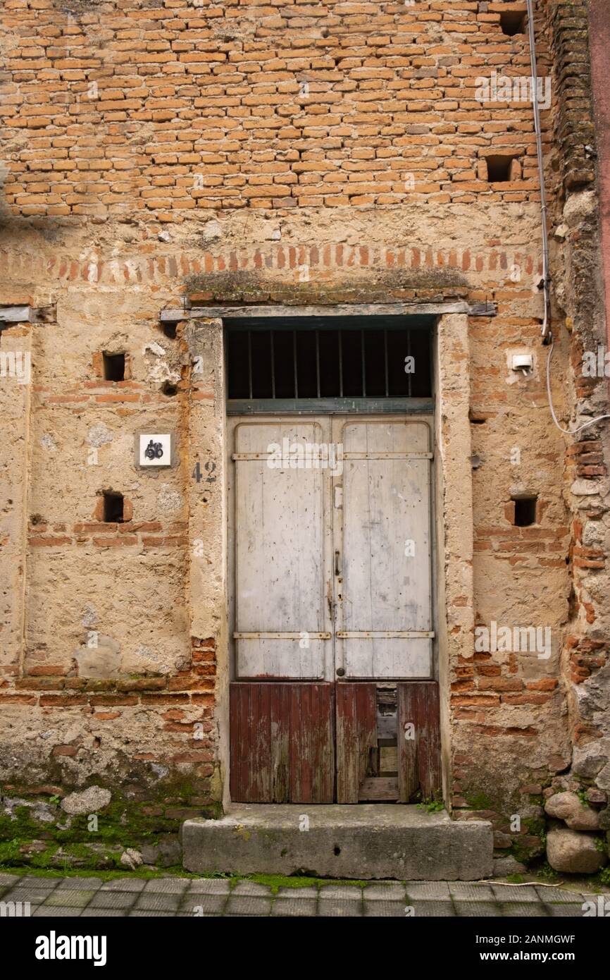 old entrance door of a ruined and peeled house Stock Photo - Alamy