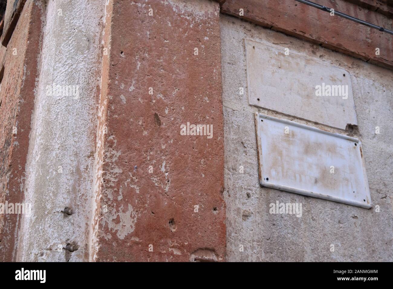 old and dilapidated wall with discolored road signs Stock Photo - Alamy