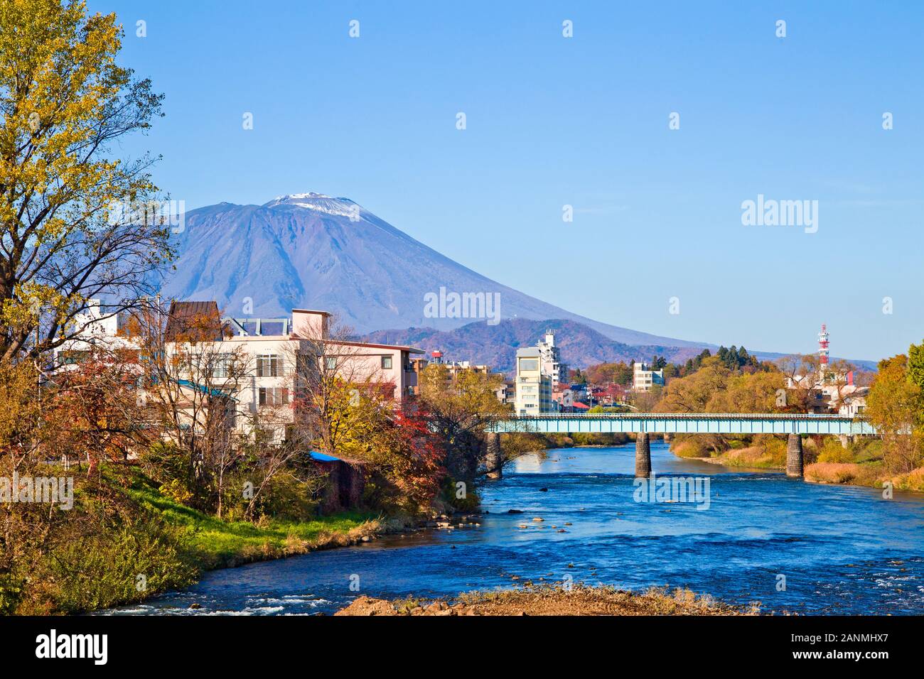 Mount Iwate scene with buildings and promenade at Katakami river in ...