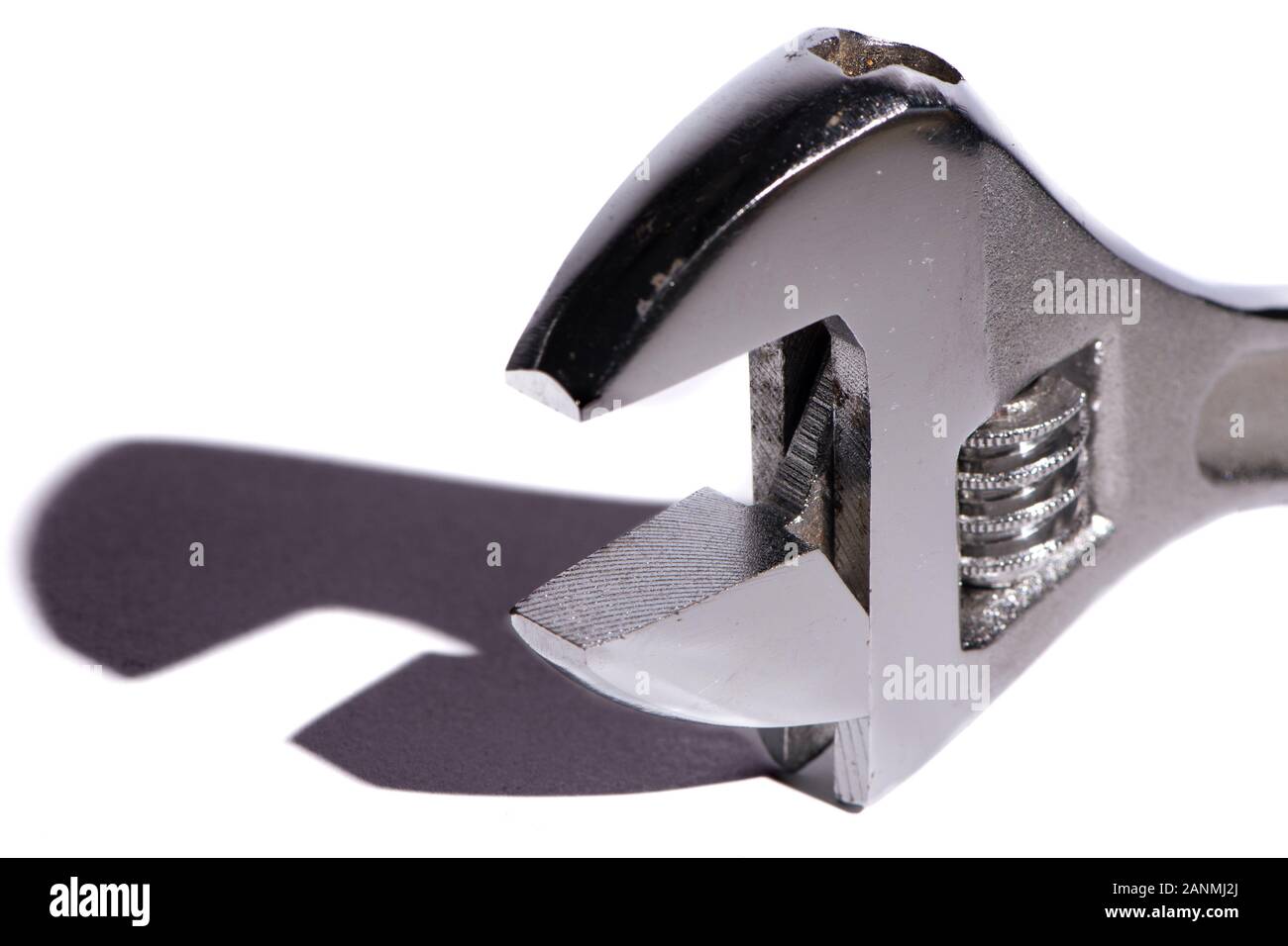 Adjustable crescent wrench with shadow on white background. Abstract ...