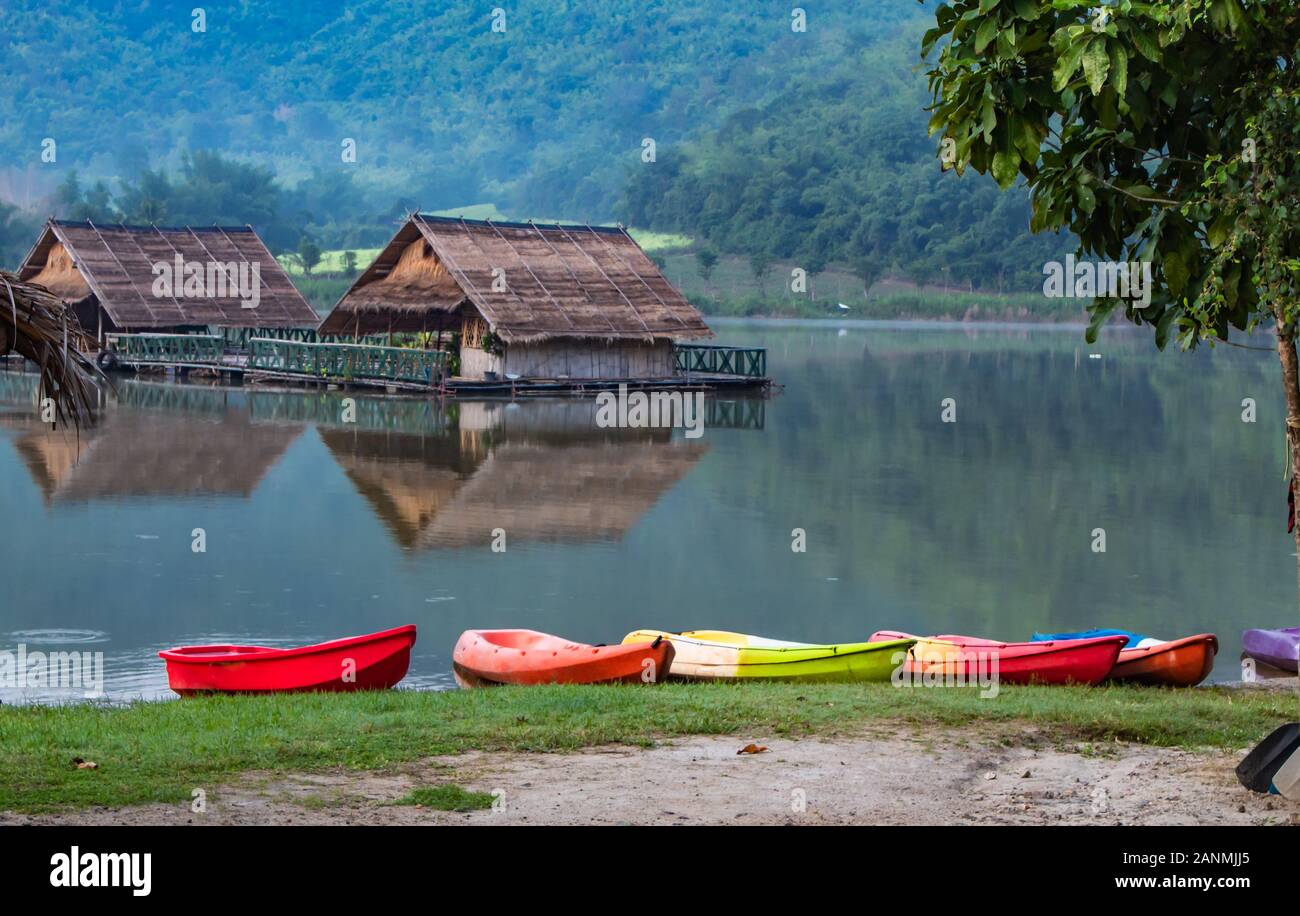 The wooden raft and Kayak in the water reservoirs and mountain views ...