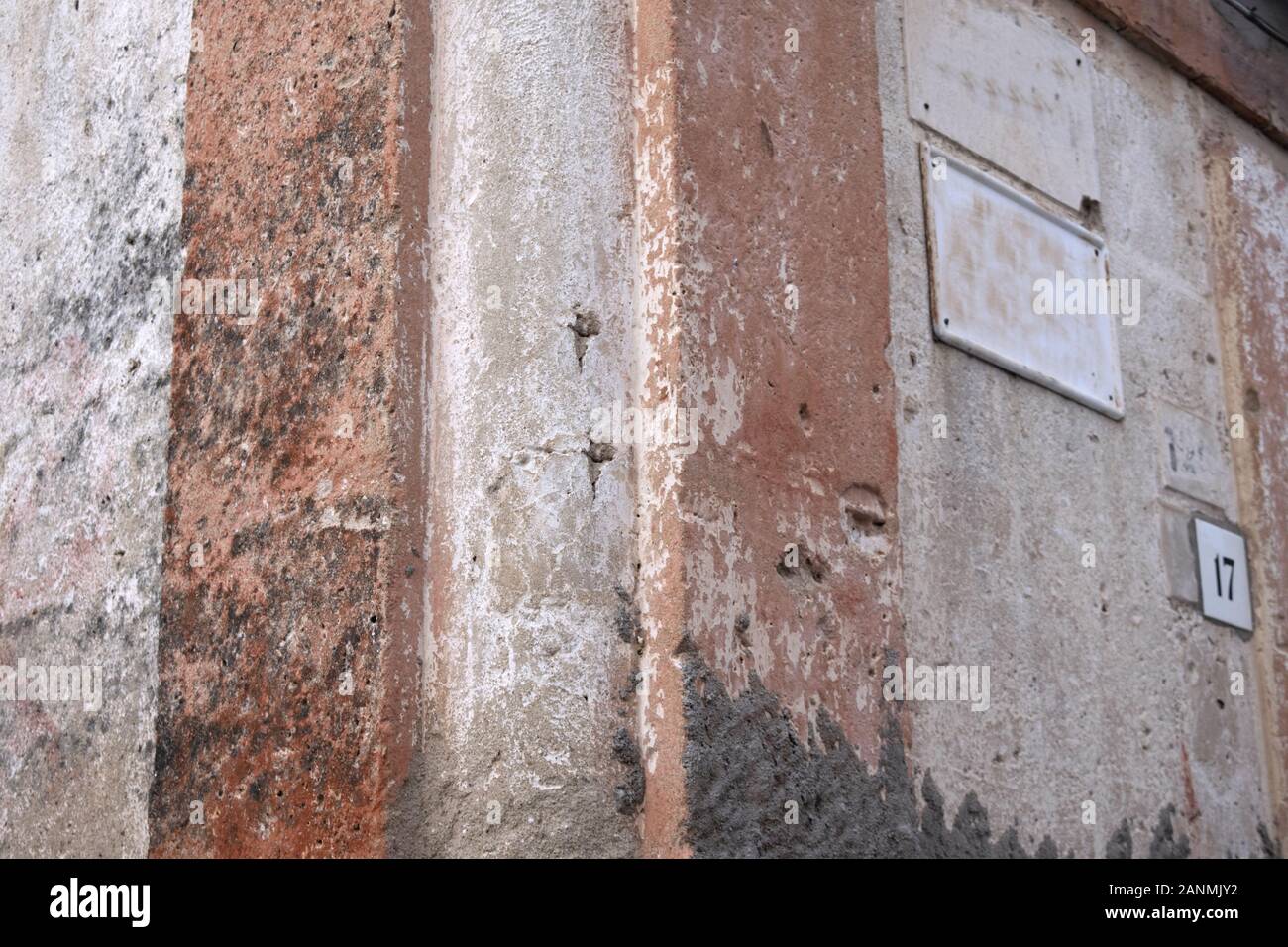 old and dilapidated wall with discolored road signs Stock Photo - Alamy