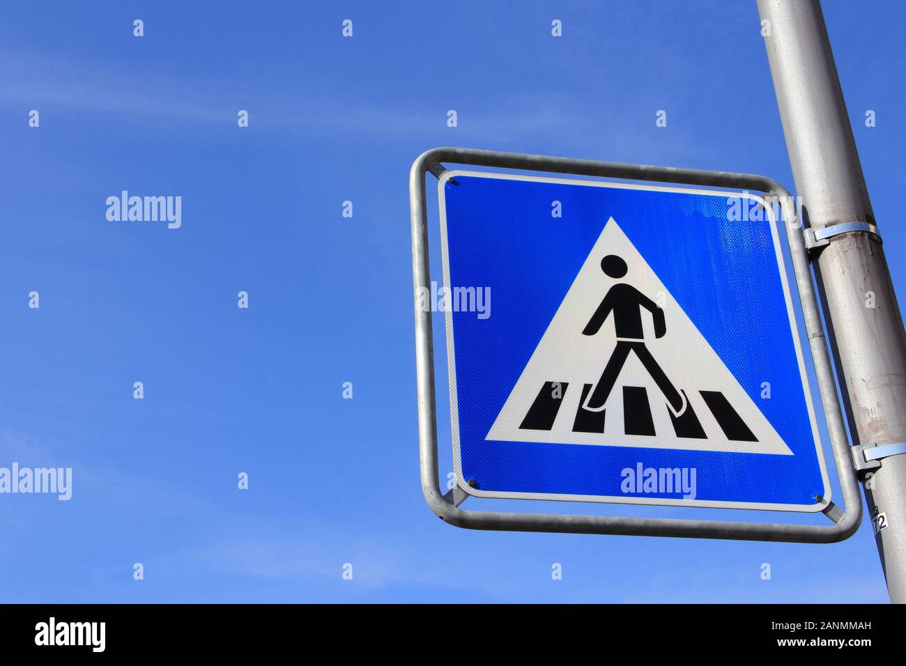 a blue sign Pedestrian crossing Stock Photo - Alamy