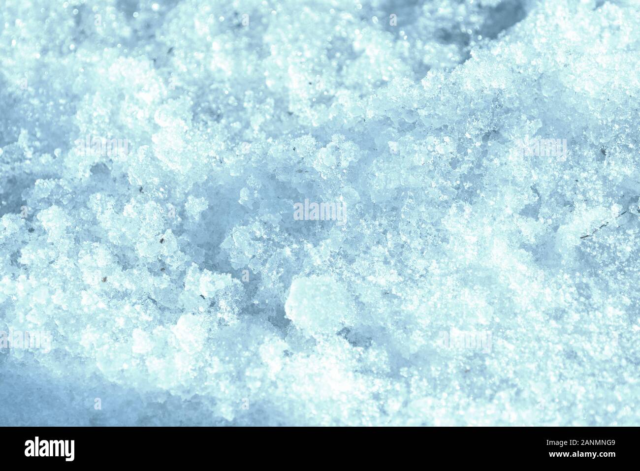 Shiny snow crystal with blue background hi-res stock photography and ...