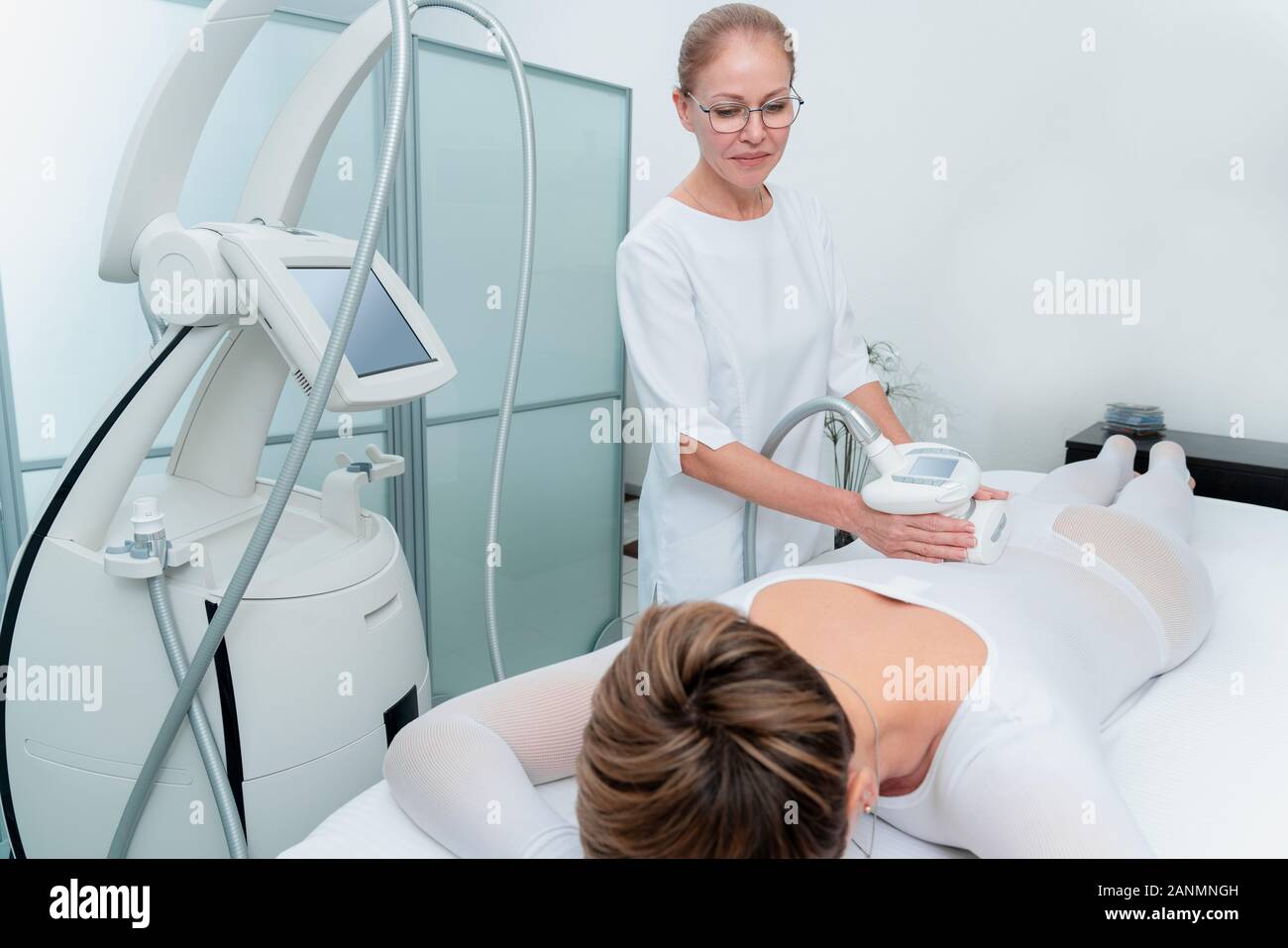 Woman In Special White Suit Getting Anti Cellulite Massage In A Spa