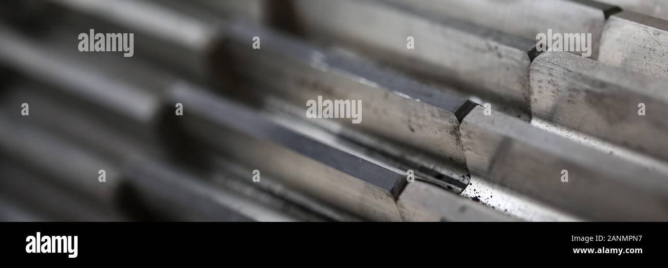 Closeup of metal cogwheel on dark background as part of full machine ...