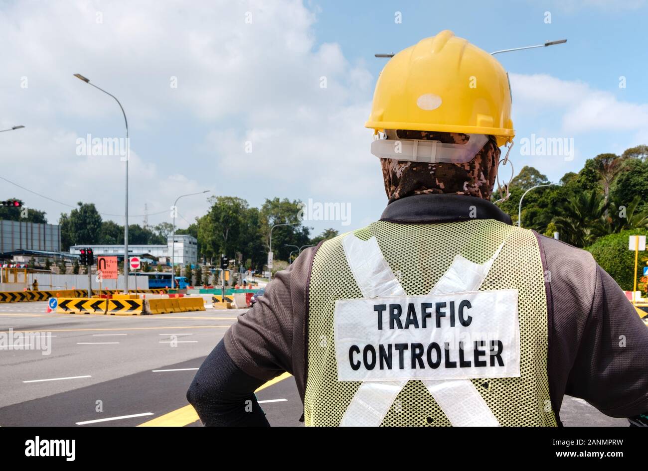 traffic controller worker stand at the road side Stock Photo - Alamy
