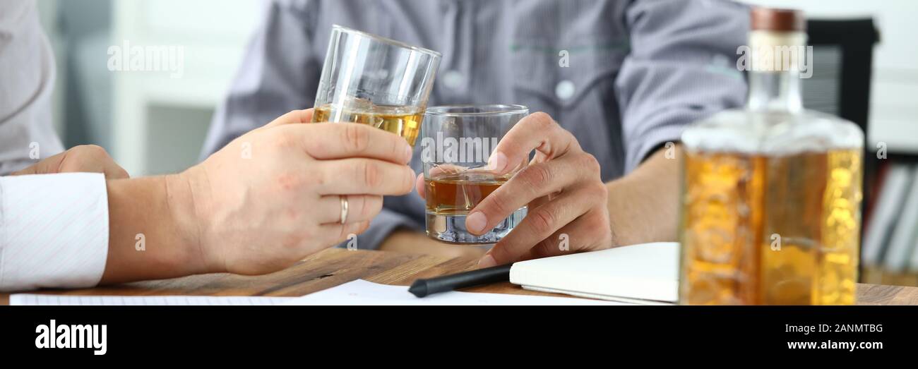 Office workers drinking alcohol hi-res stock photography and images - Alamy