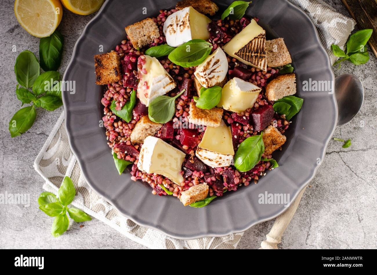 Beautiful salad from buckwheat and beet with grilled fish Stock Photo ...