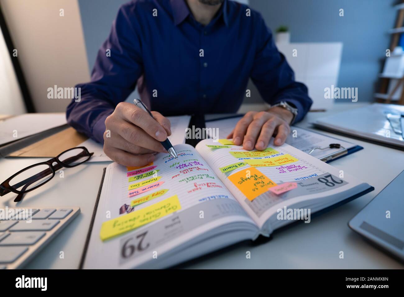 Close-up Of Businessman Writing Schedule In Calendar Diary Stock Photo ...