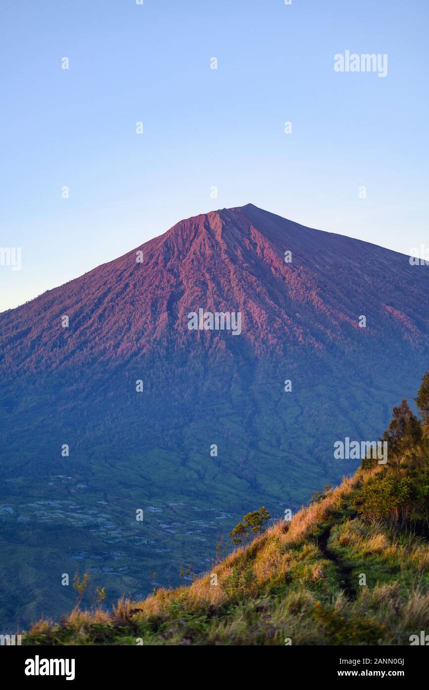 (Selective focus) Stunning view of the Mount Rinjani illuminated by a ...