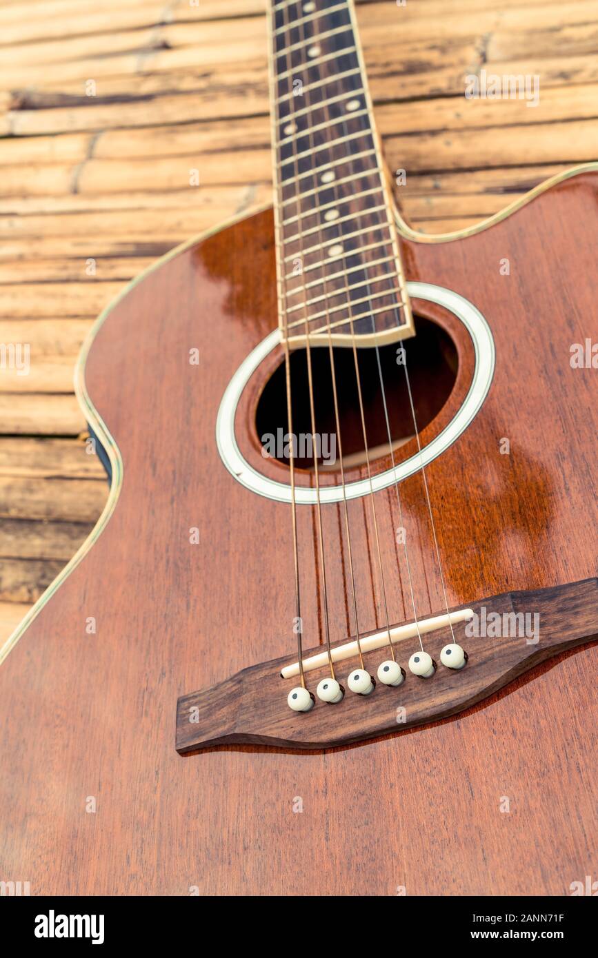 Classical guitar on wood background. Music and entertainment concept ...