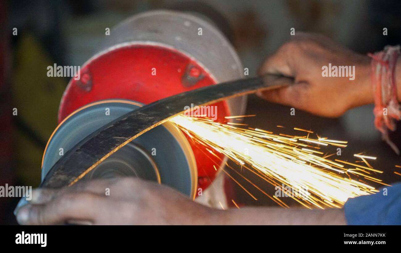 Man sharpening blade in Jodhpur, India Stock Photo - Alamy