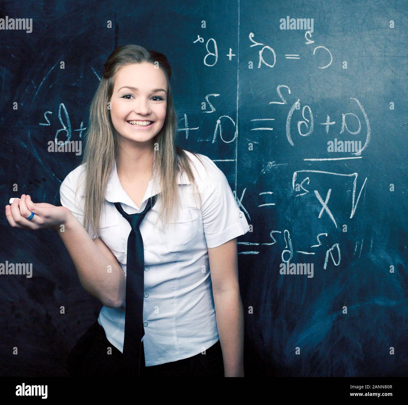 portrait of happy cute student with book in classroom Stock Photo - Alamy