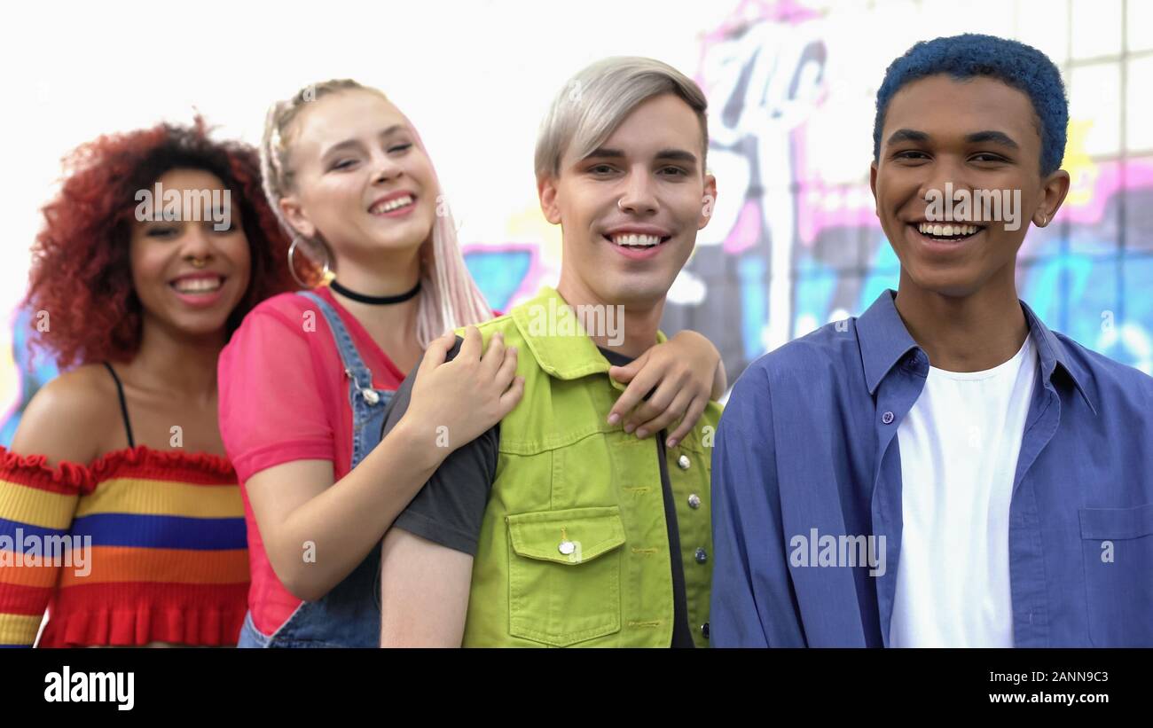 Joyful young people having fun together enjoying friendship connection ...