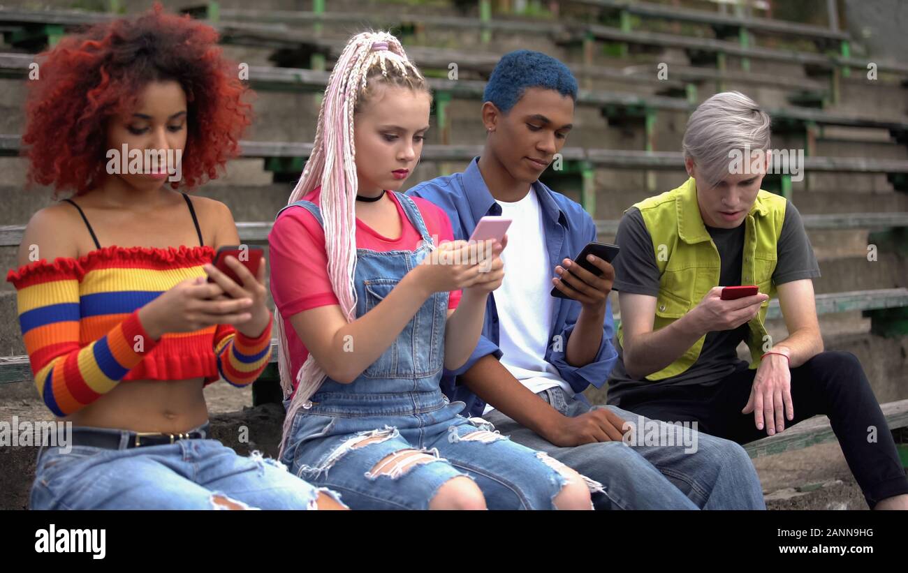 Addicted teenagers scrolling smartphones, online connection cyber ...
