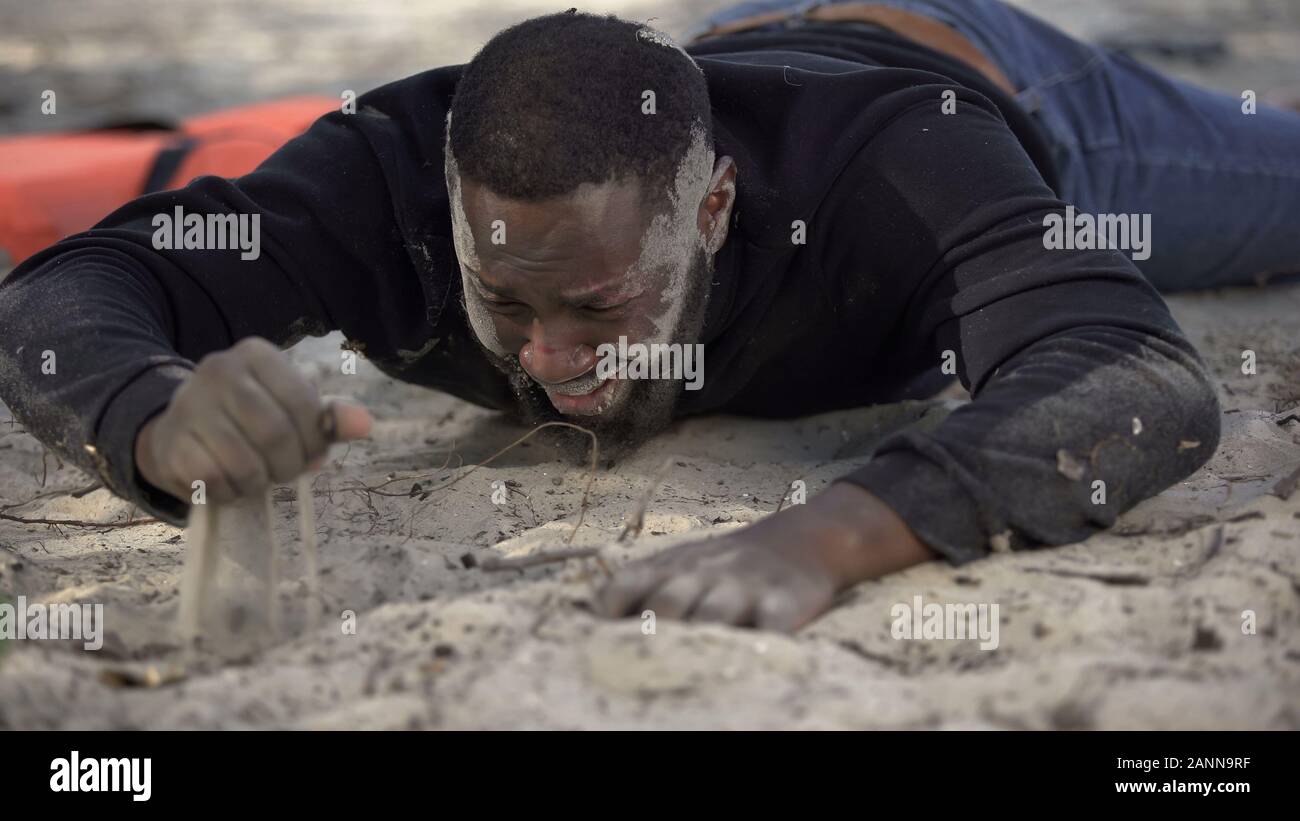 Male refugee with muddy face crying, survived shipwreck, illegal border ...