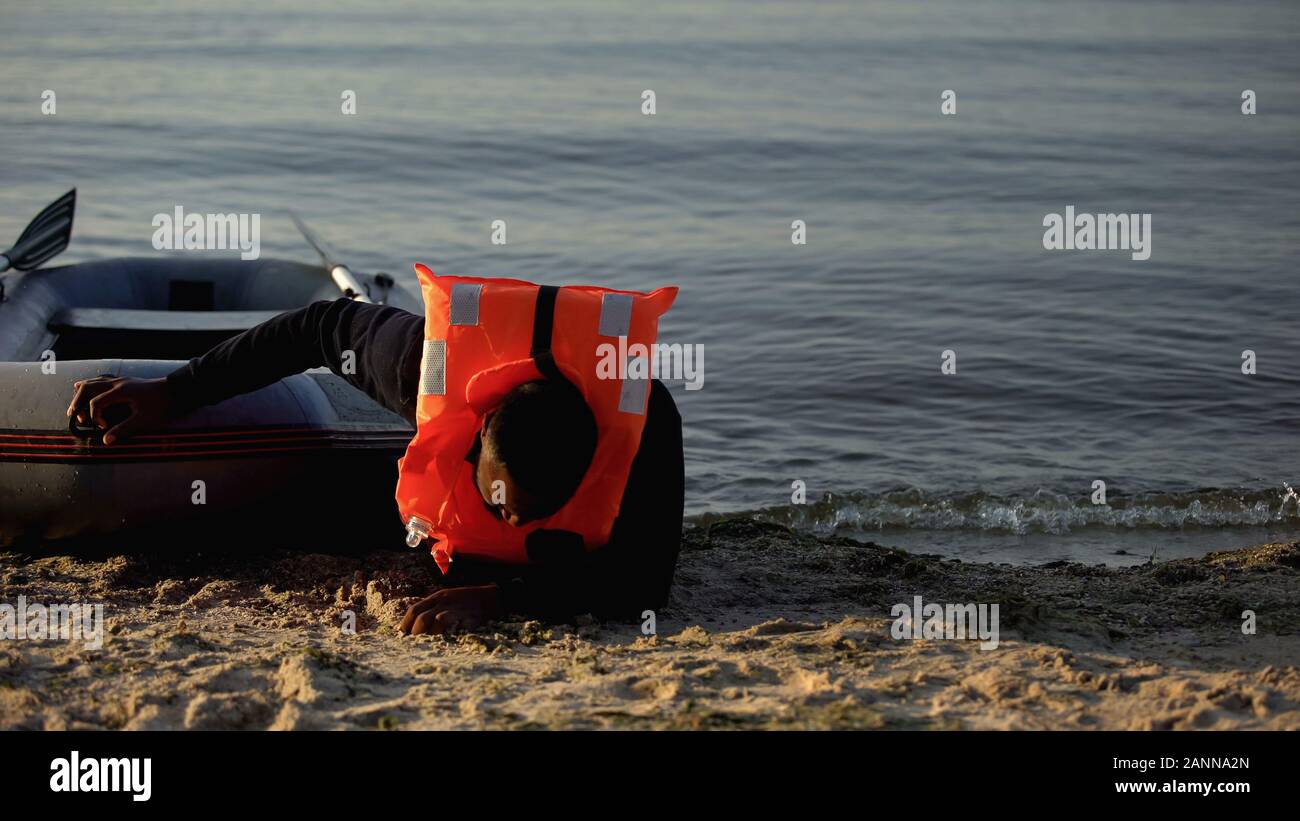 African-american man, pulling boat falling on shore, refugee survived ...