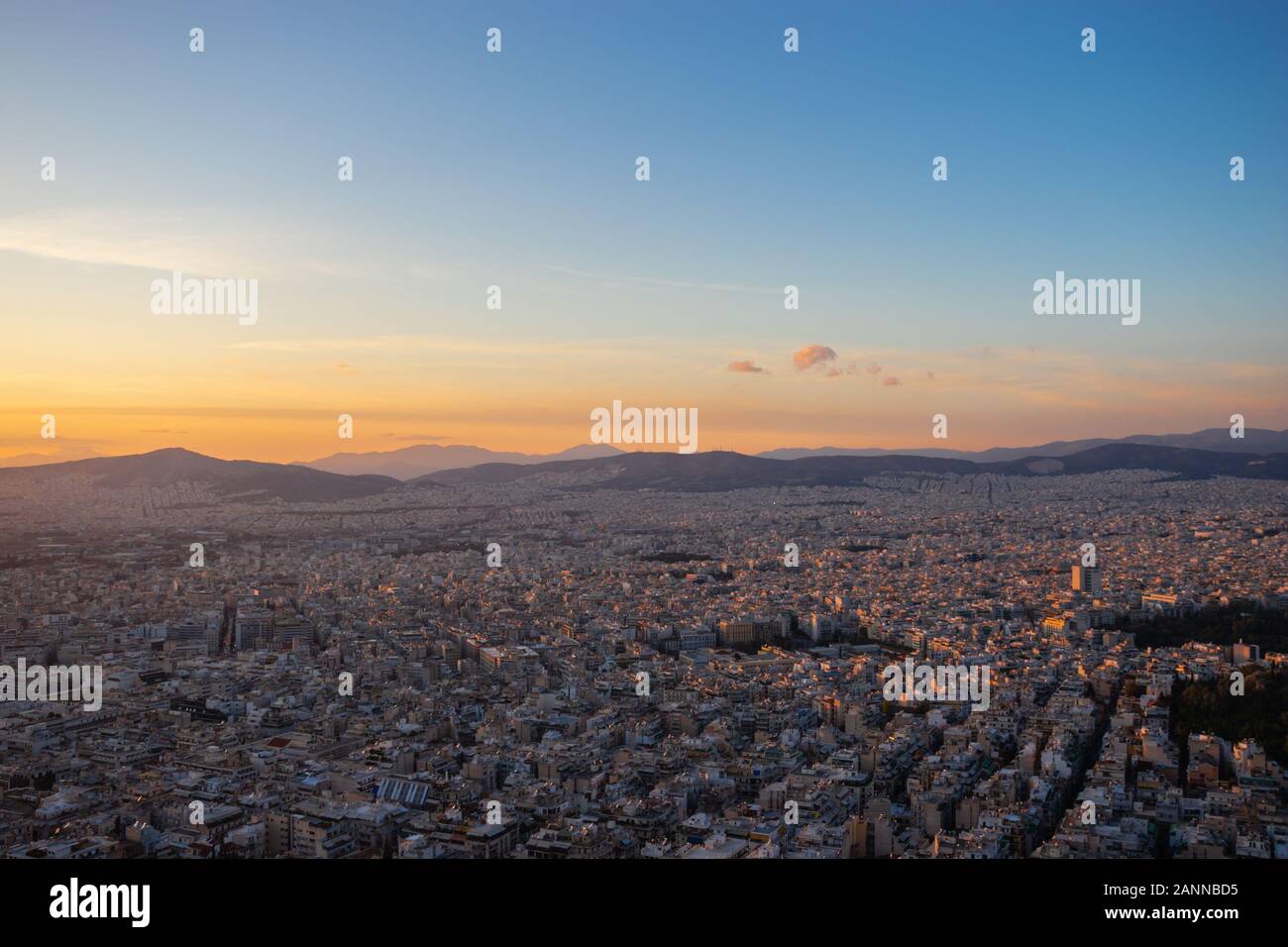 Sunset in Athens on a cloudy sky with a city view from Lycabettus hill ...