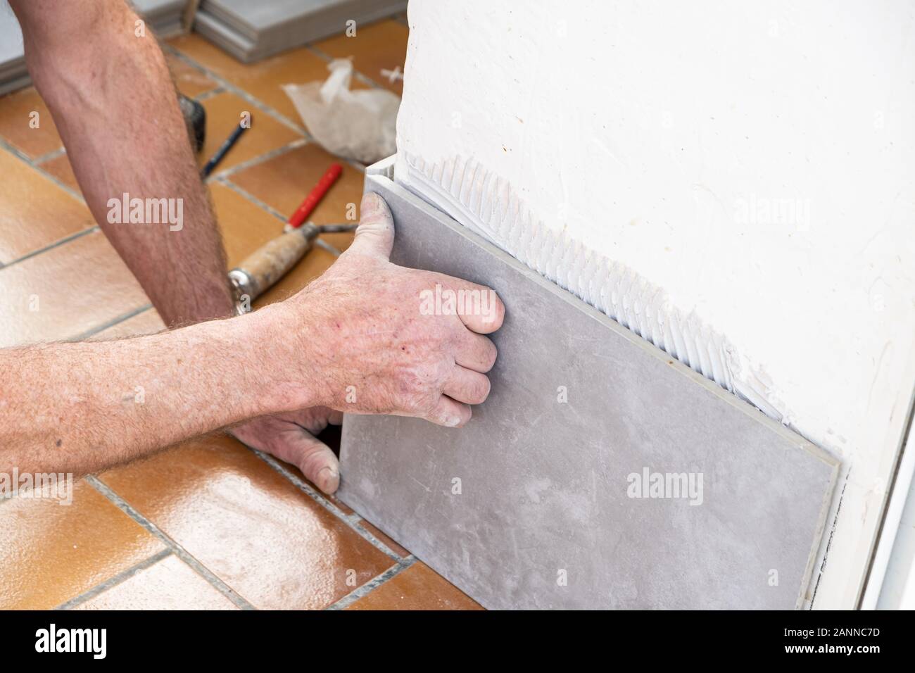Tiler lays tiles hi-res stock photography and images - Alamy