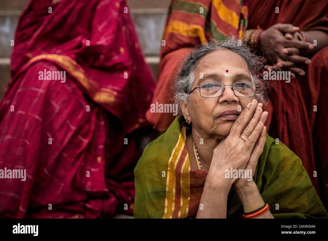 Woman sitting in the ghats of Varanasi. India Stock Photo - Alamy