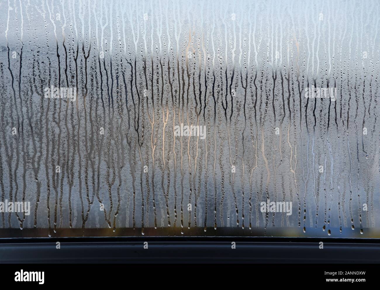 Cold weather outdoors can cause condensation on the window Stock Photo ...