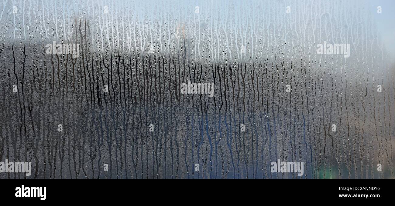 Cold weather outdoors can cause condensation on the window Stock Photo ...