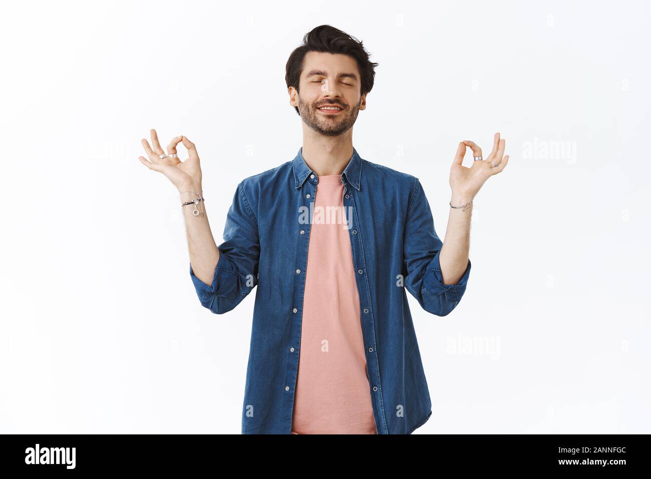 Happy relieved bearded guy reaching nirvana, calm down as meditating ...