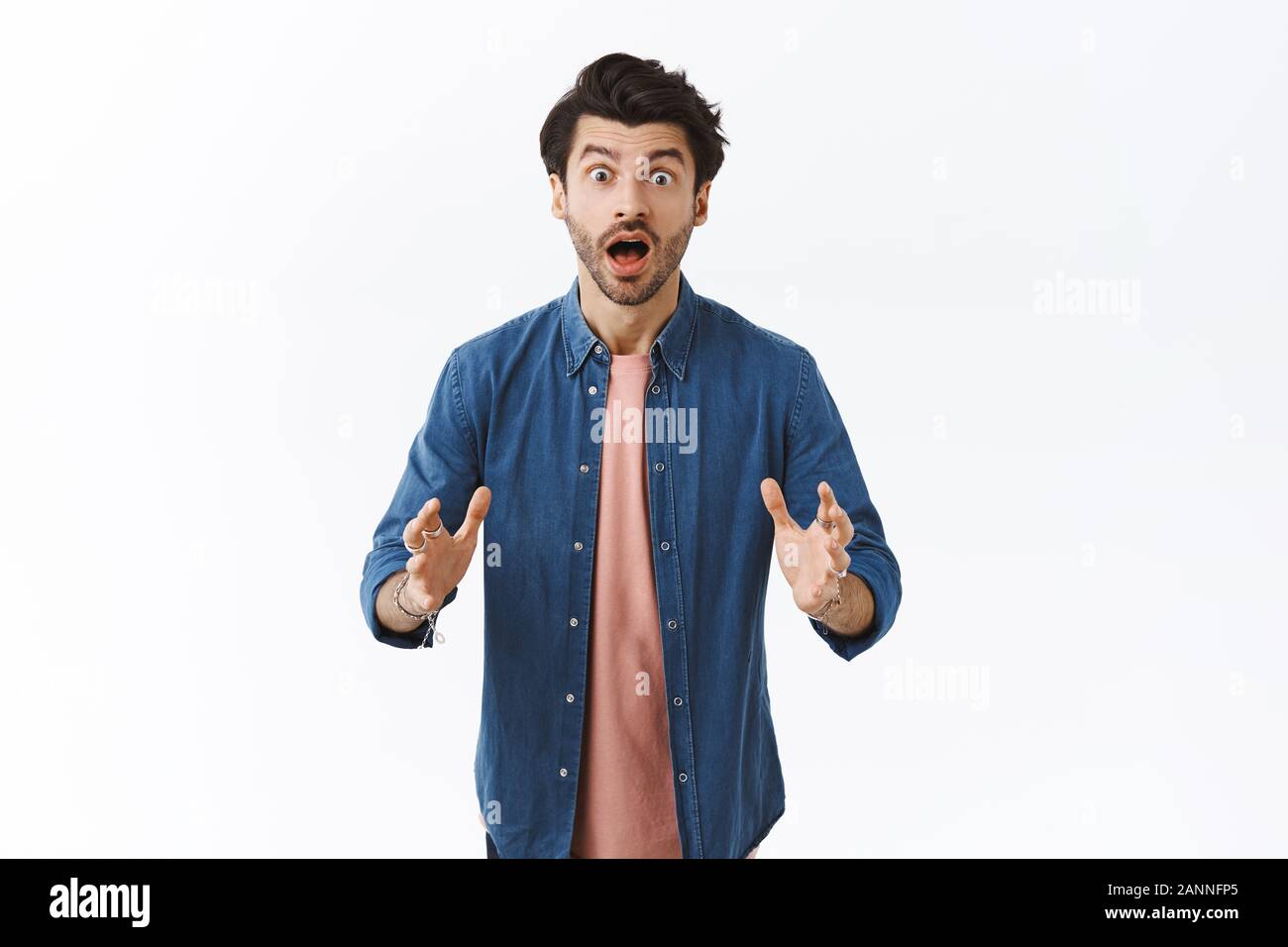 Shocked, concerned intense young man staring at camera, worry something ...