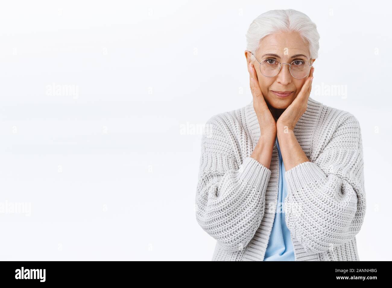 Aging, holidays and people concept. Charming senior lady with grey ...