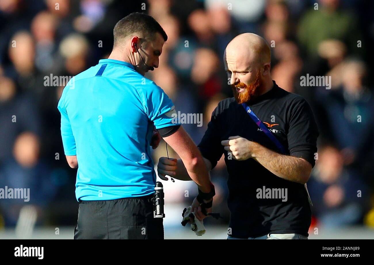 Referee Michael Oliver has his VAR kit fixed during the Premier League ...