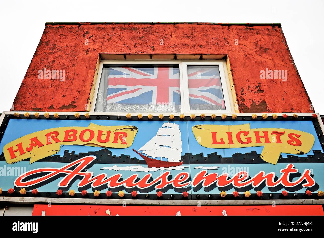 Front of amusement arcade with large Union Jack in first floor window ...