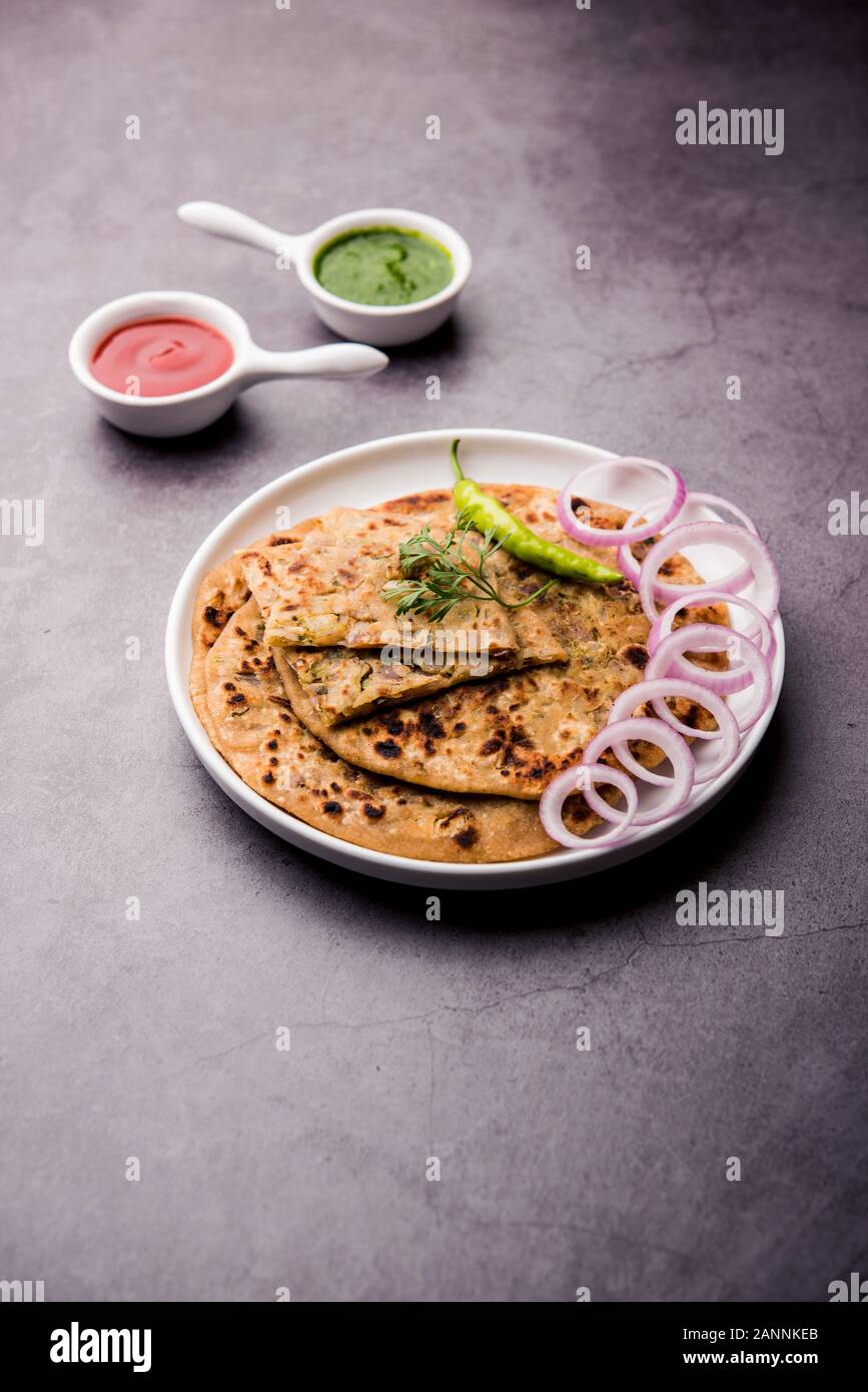 Onion Parotha / Pyaj parantha / kanda paratha served with tomato ...