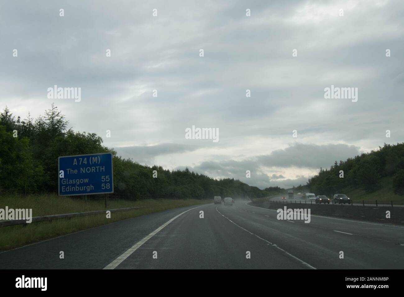 Motorway sign Scotland weather outside storm stormy black clouds car ...