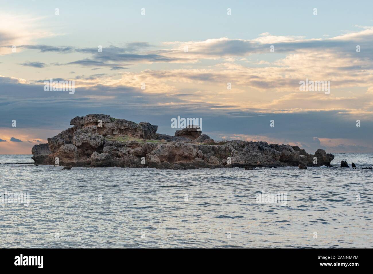 Sunset at the beach of Byblos with a view of a rocky island Stock Photo ...