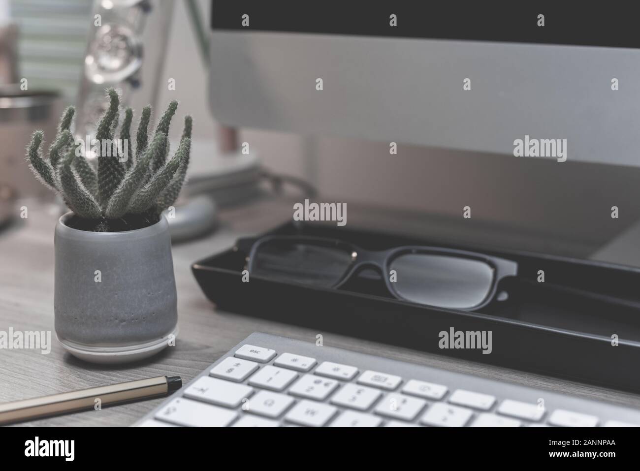Modern office desk with computer keyboard and office objects on wooden ...