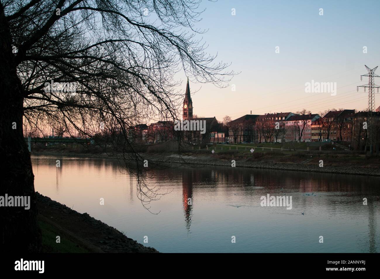 the riverside town at sundown Stock Photo - Alamy