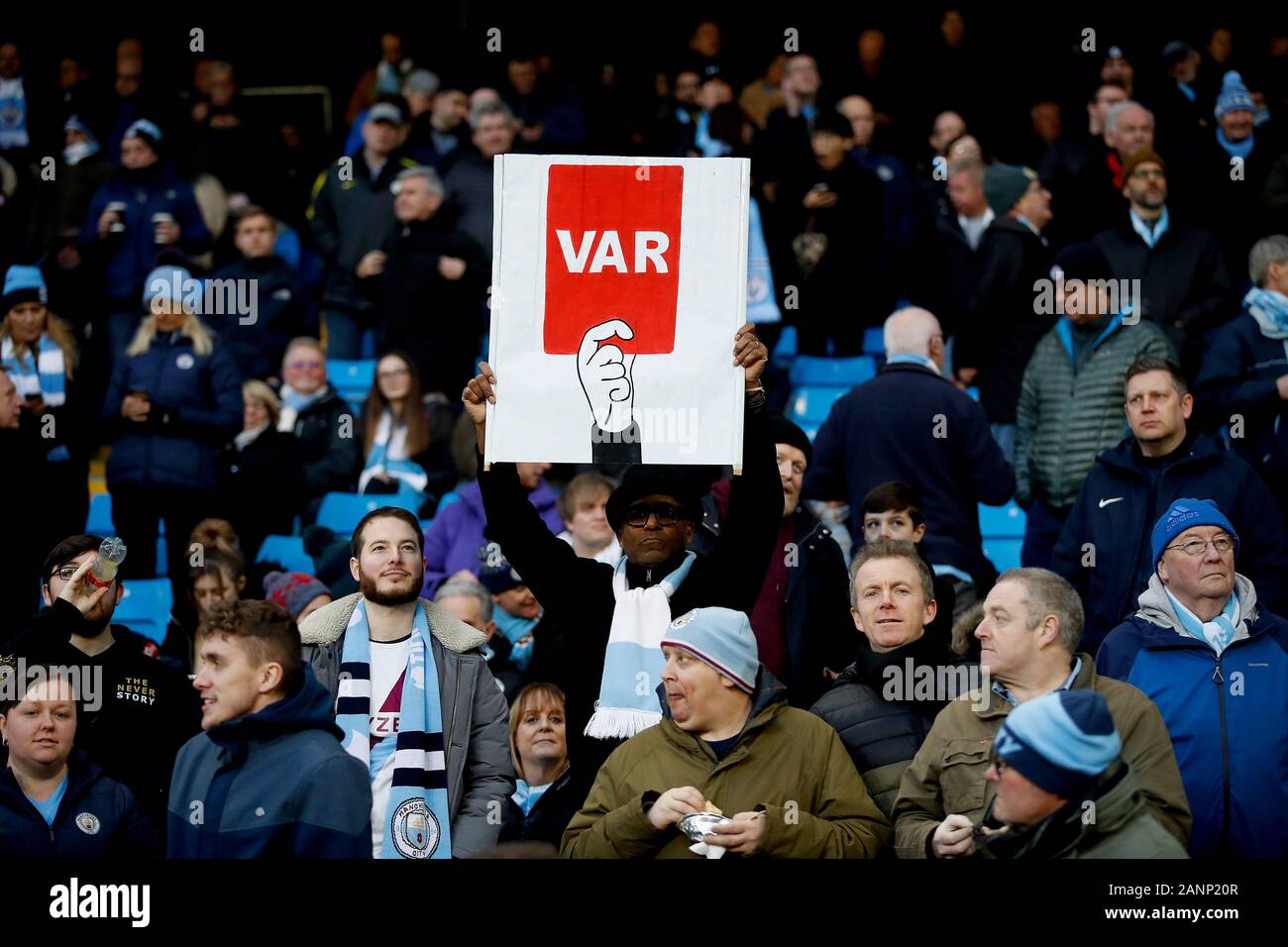 A Manchester City fan holds up an anti-VAR sign in the stands during ...