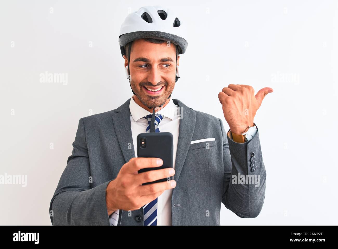 Young Handsome Business Man Wearing Bike Helmet Using Smartphone Over