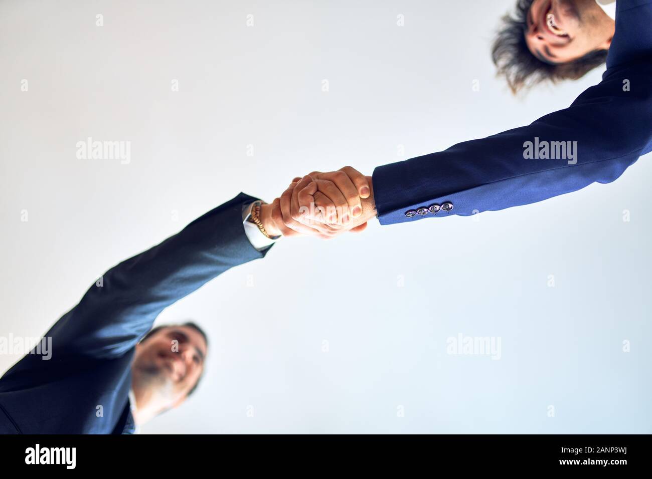 Two businessmen smiling happy and confident. Standing with smile on ...