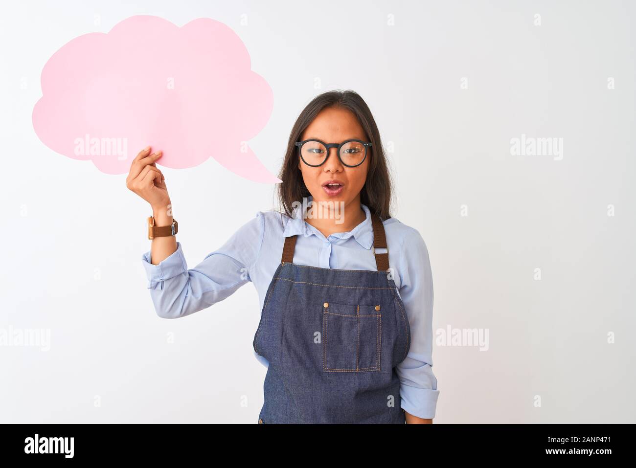 Chinese woman wearing glasses apron holding speech bubble over isolated ...