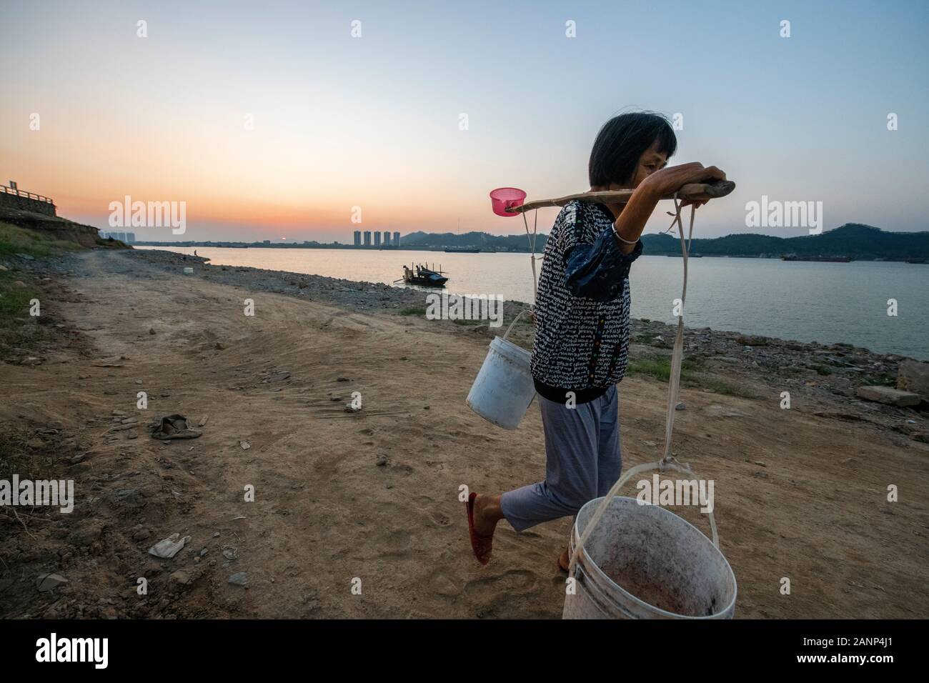 Asian woman with balancing pole hi-res stock photography and images - Alamy