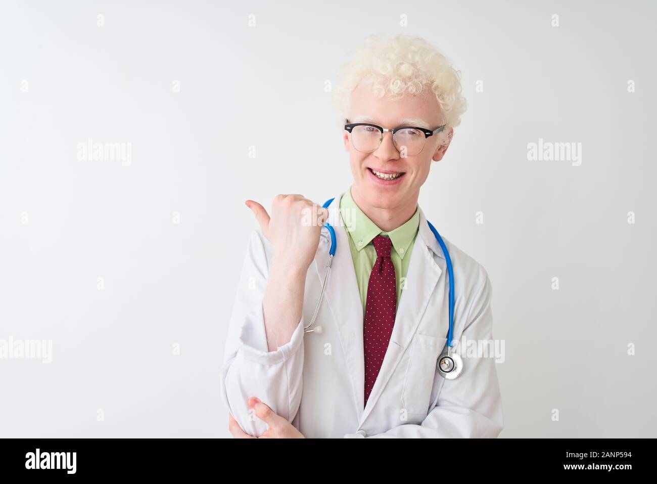 Young albino doctor man wearing stethoscope standing over isolated ...