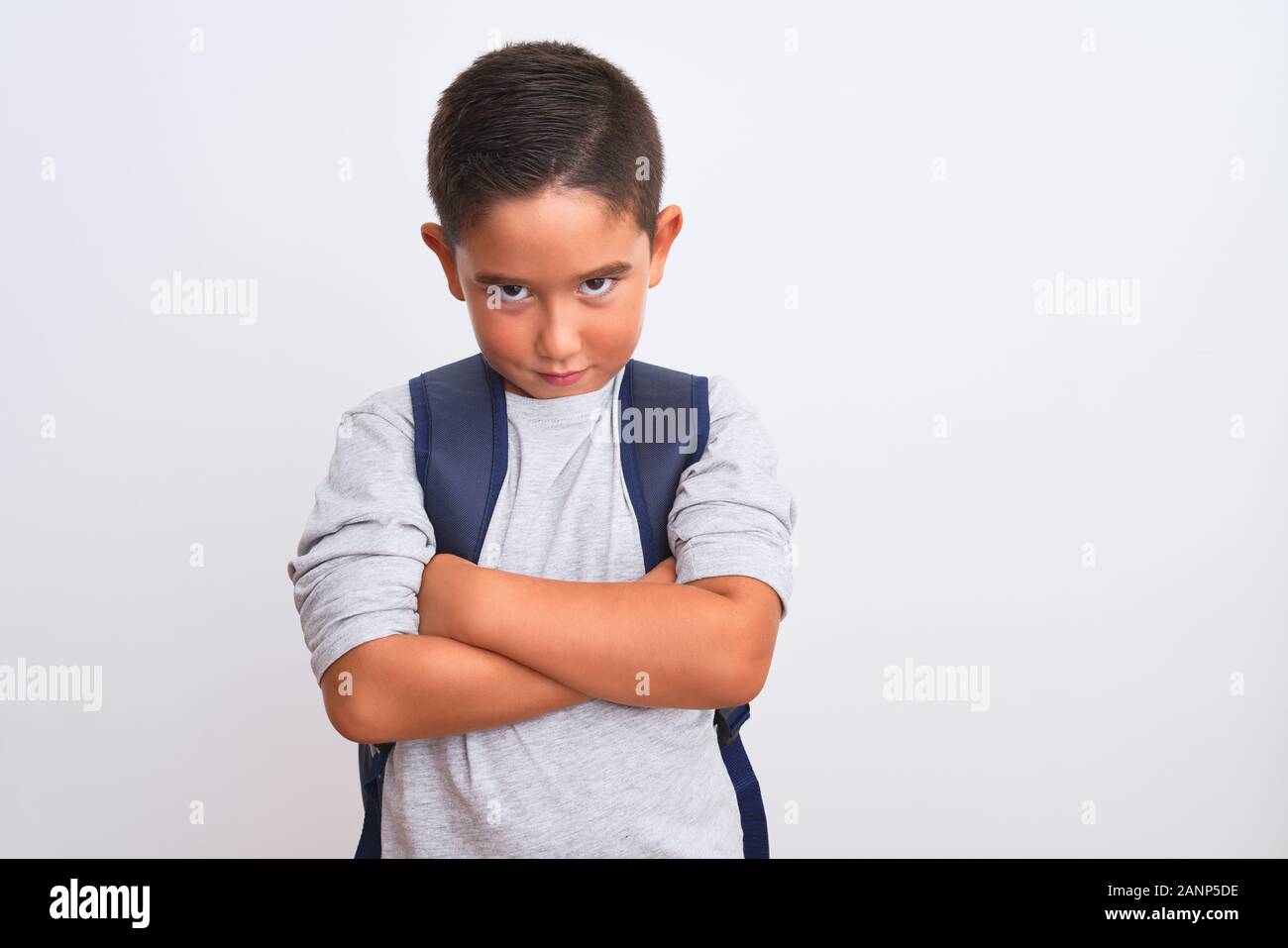 Beautiful student kid boy wearing backpack standing over isolated white ...