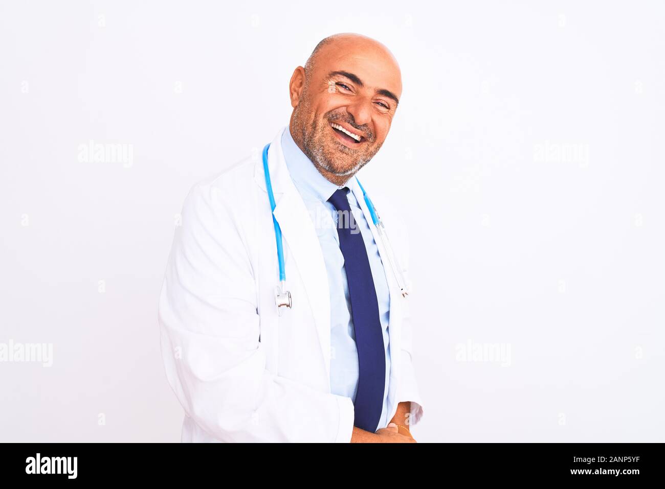 Middle age doctor man wearing stethoscope and tie standing over ...