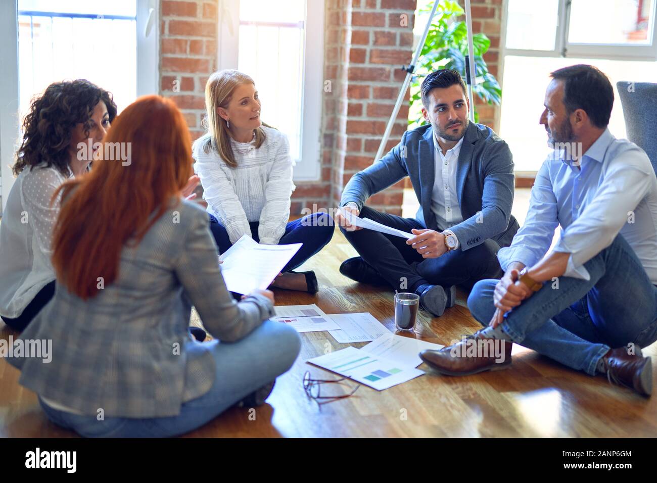 Group of business workers smiling happy and confident. Sitting on the ...
