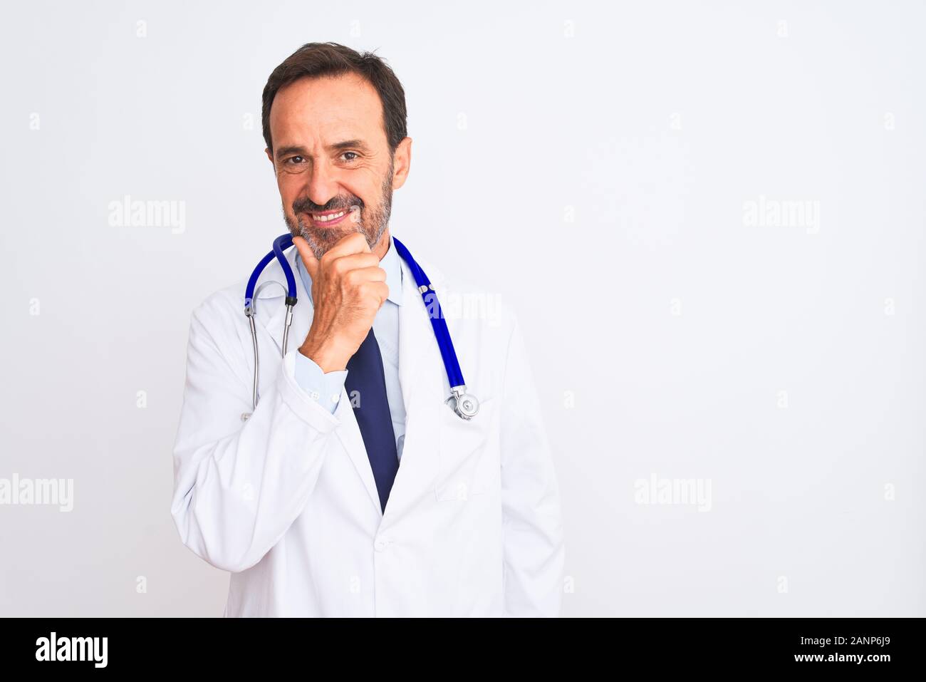 Middle age doctor man wearing coat and stethoscope standing over ...