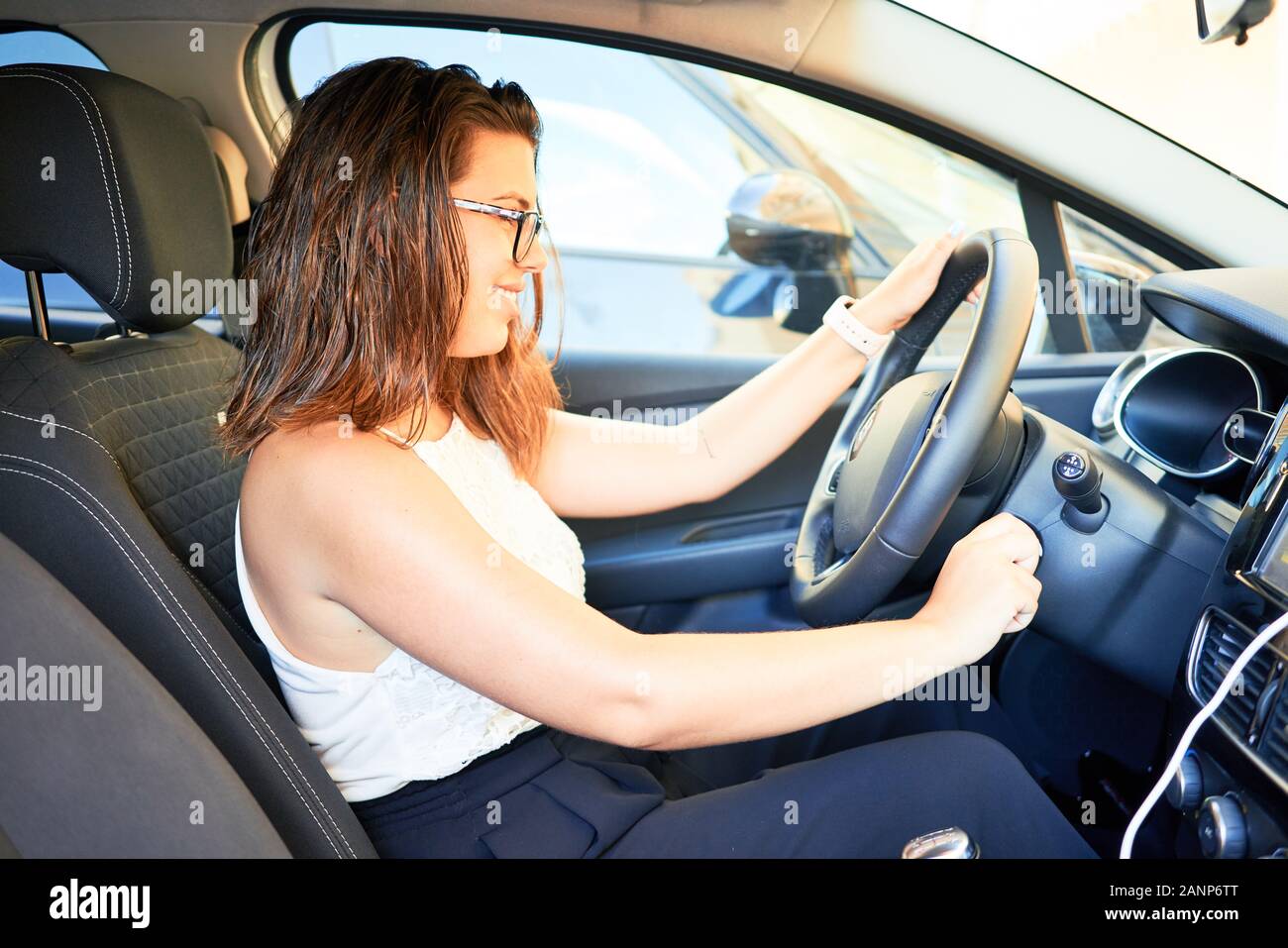 Young driver woman driving car Stock Photo - Alamy