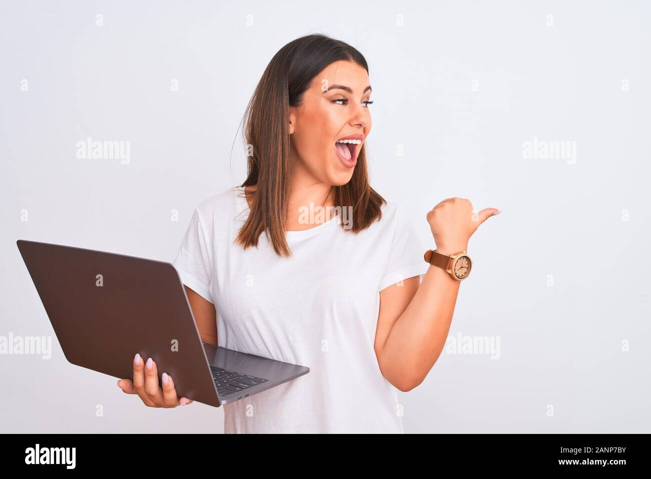 Beautiful young woman working using computer laptop over white ...